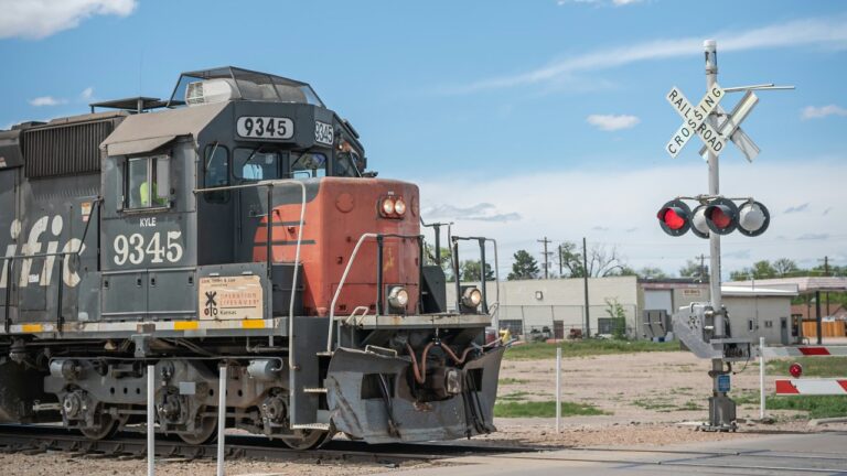 A Dodge Challenger Hellcat gets stranded on tracks as a freight train ...